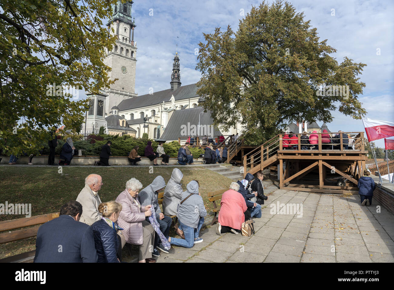 People praying at the field altar outside the Jasna Góra monastery ...