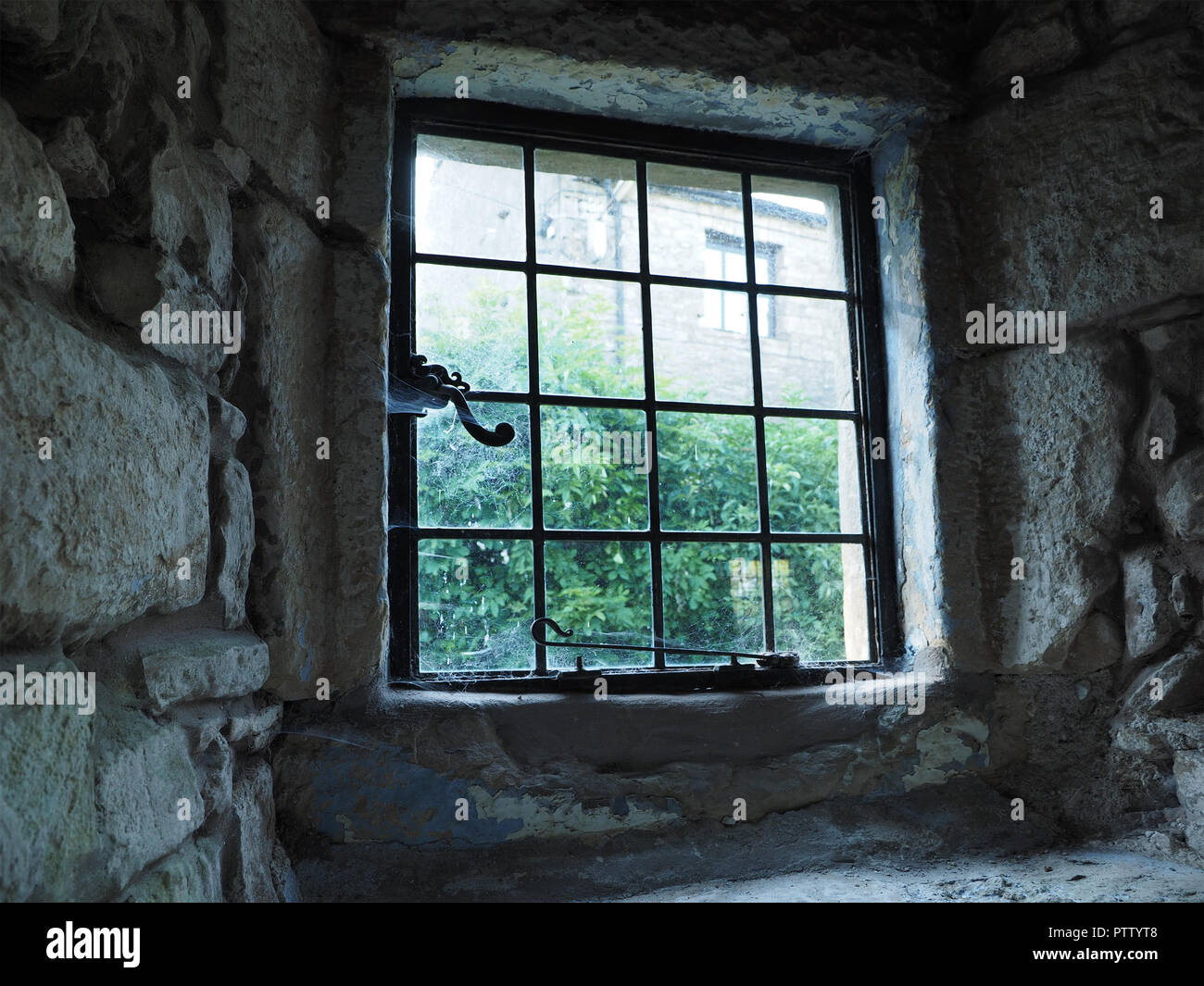 ancient shady window with ornate ironwork catch and handle, & metal ...