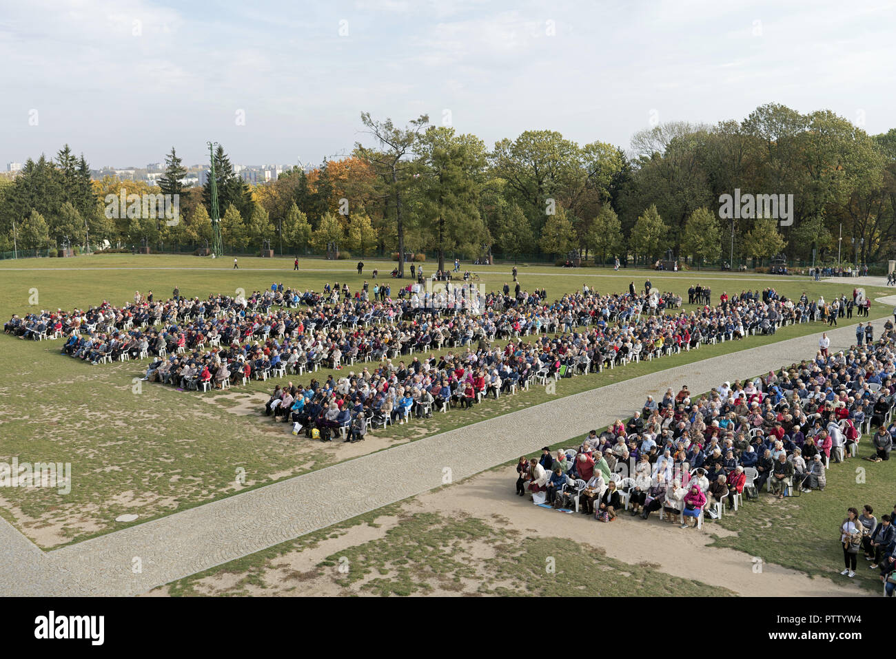 People praying at the field altar outside the Jasna Góra monastery ...