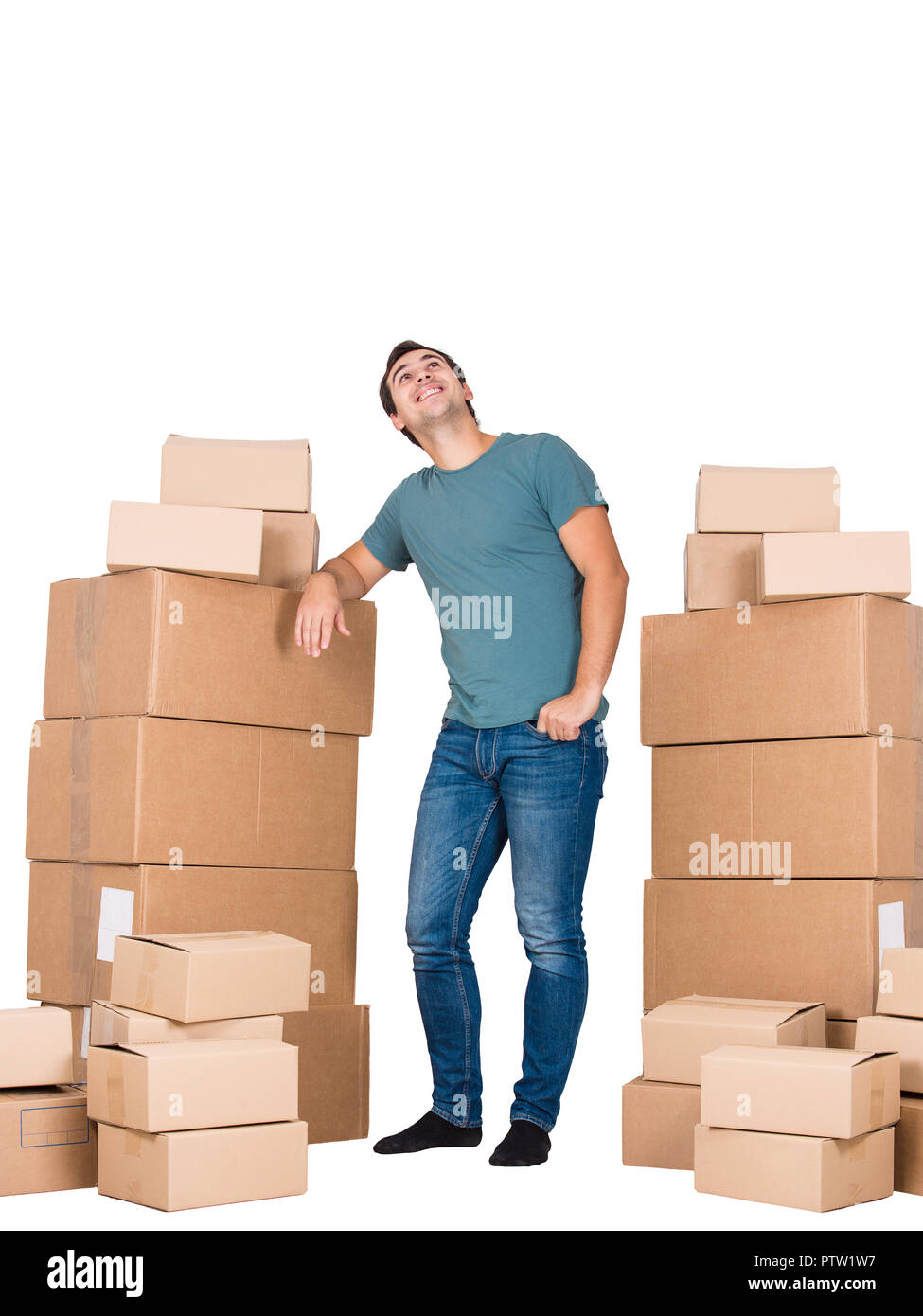Full length portrait of young man leaning on cardboard boxes thoughtful ...