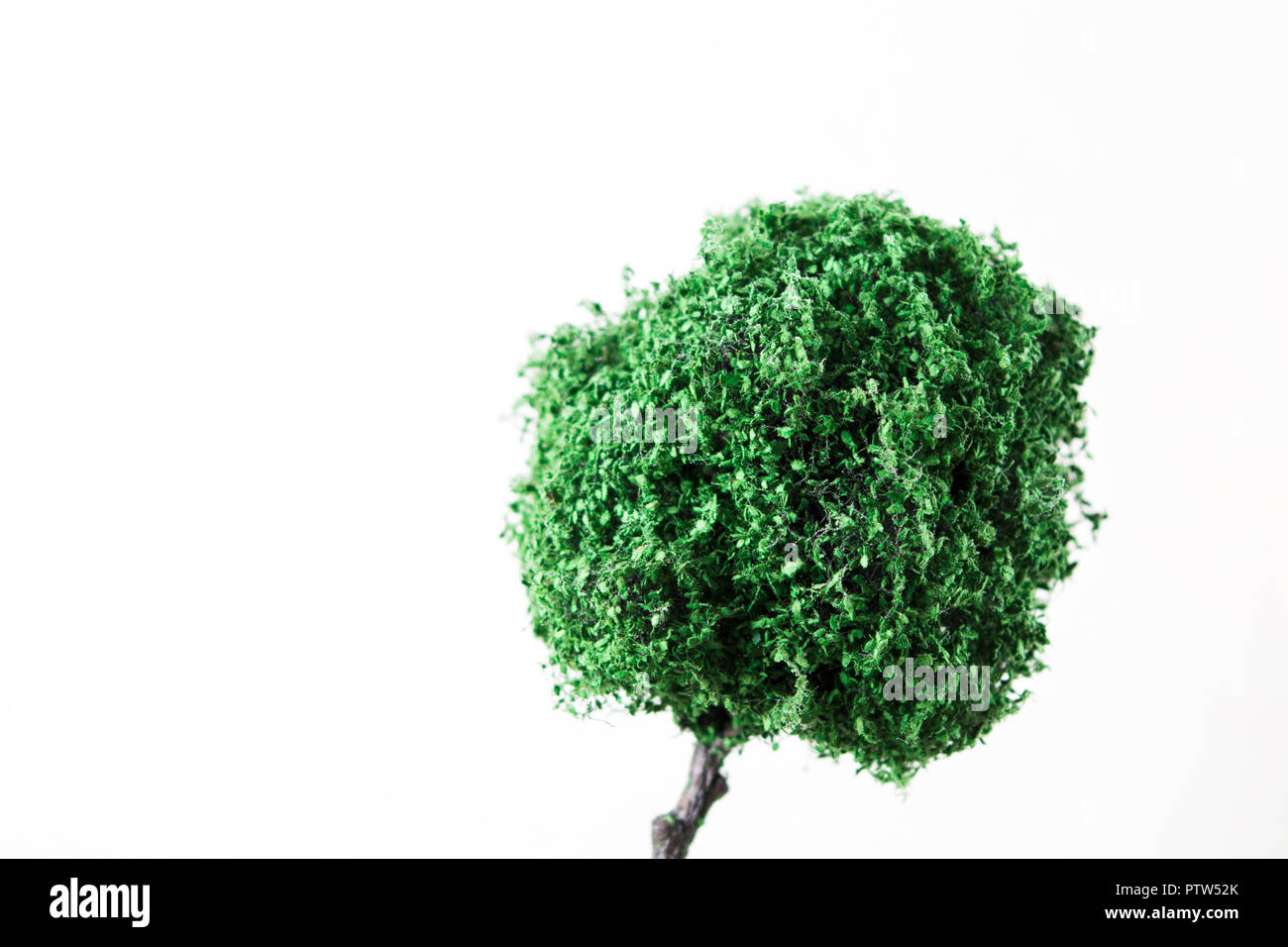 Unreal small green miniature of tree for design on white background ...