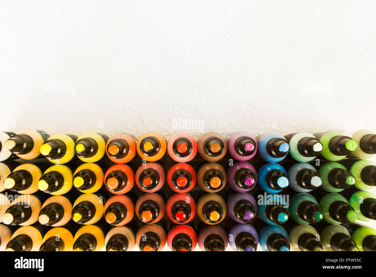 Bottles with color paints in plastic bottles on white background with ...