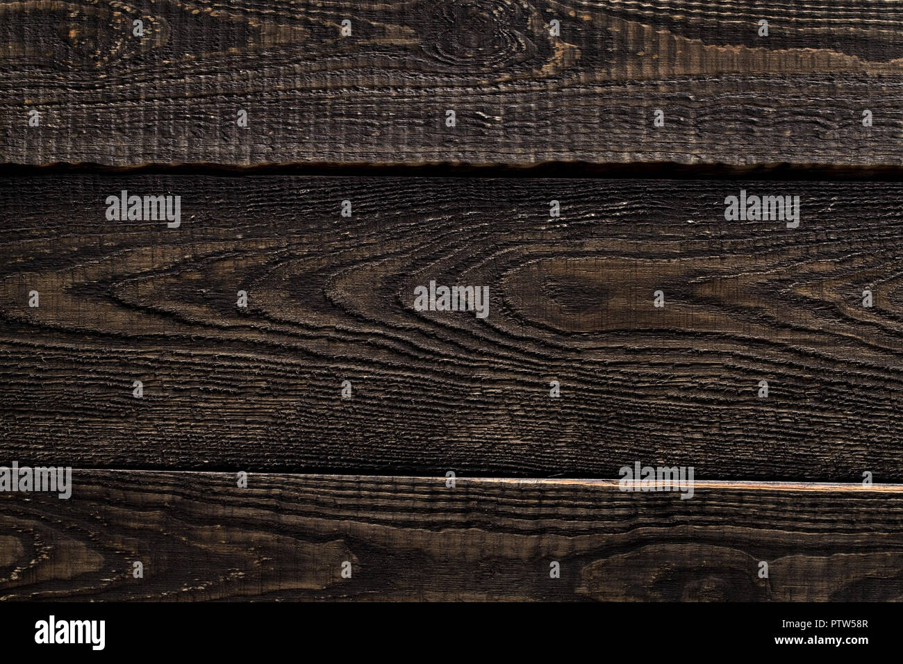 Close up of dark rustic wall made of old wood table planks texture ...