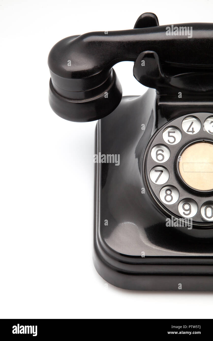 Old-fashioned phone isolated on a white background Stock Photo - Alamy