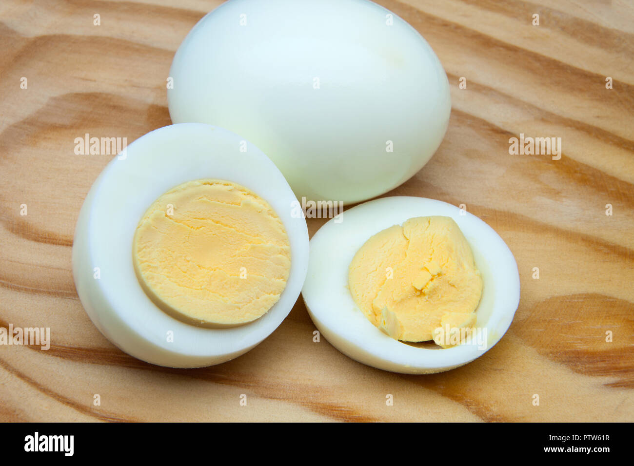 cut boiled egg on a wood Stock Photo - Alamy