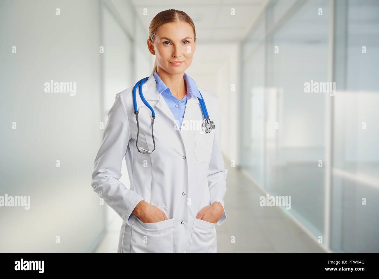 Doctor blonde in lab coat in the clinic Stock Photo - Alamy