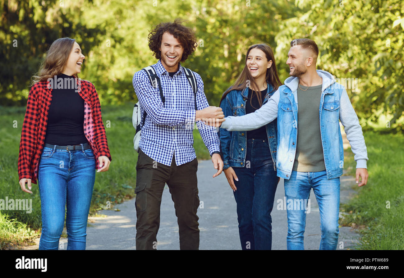 Happy friends are laughing at the park. Friendship of young people ...