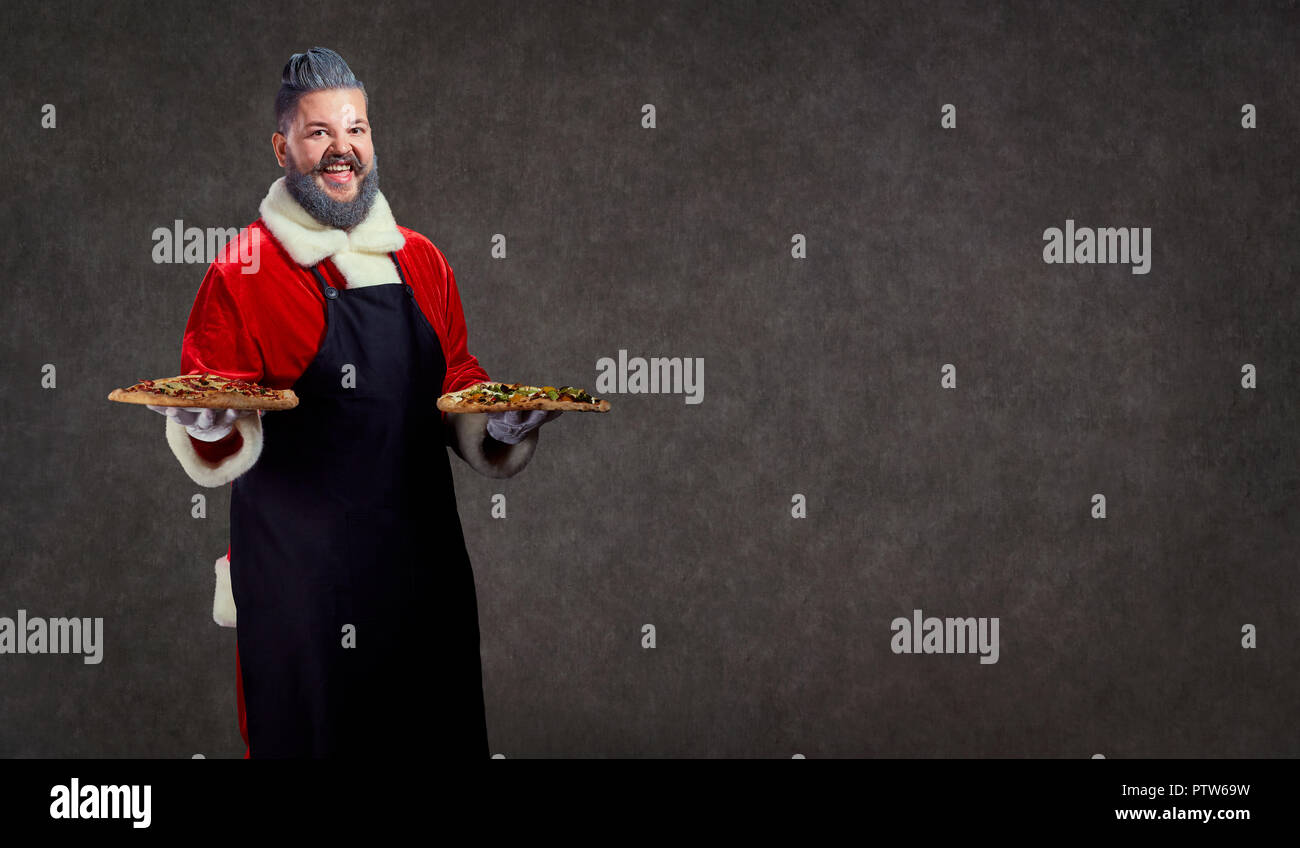 Santa Claus with pizza in hands Stock Photo - Alamy