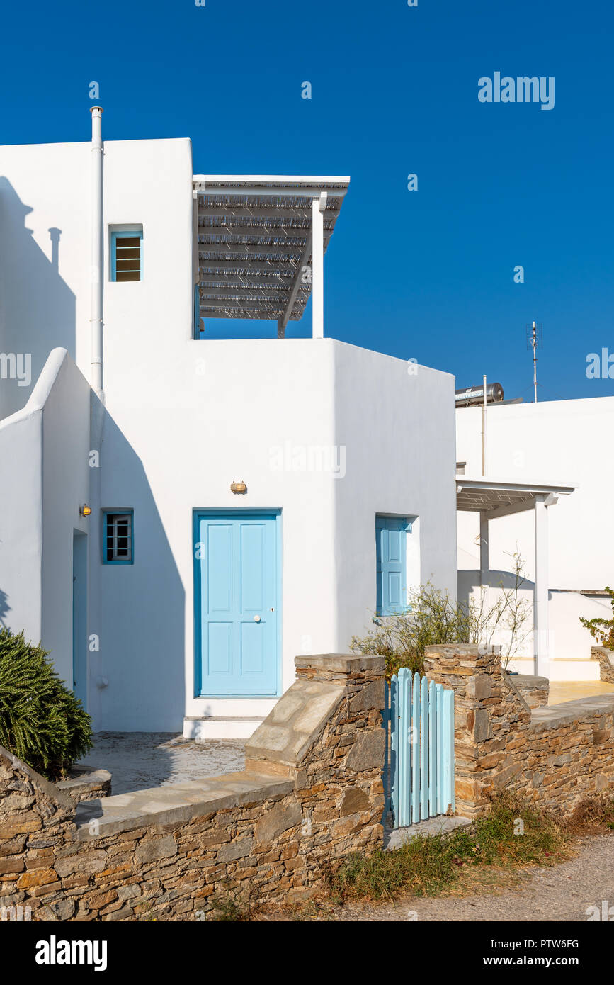 Beautiful cycladic architecture with whitewashed walls and blue doors ...