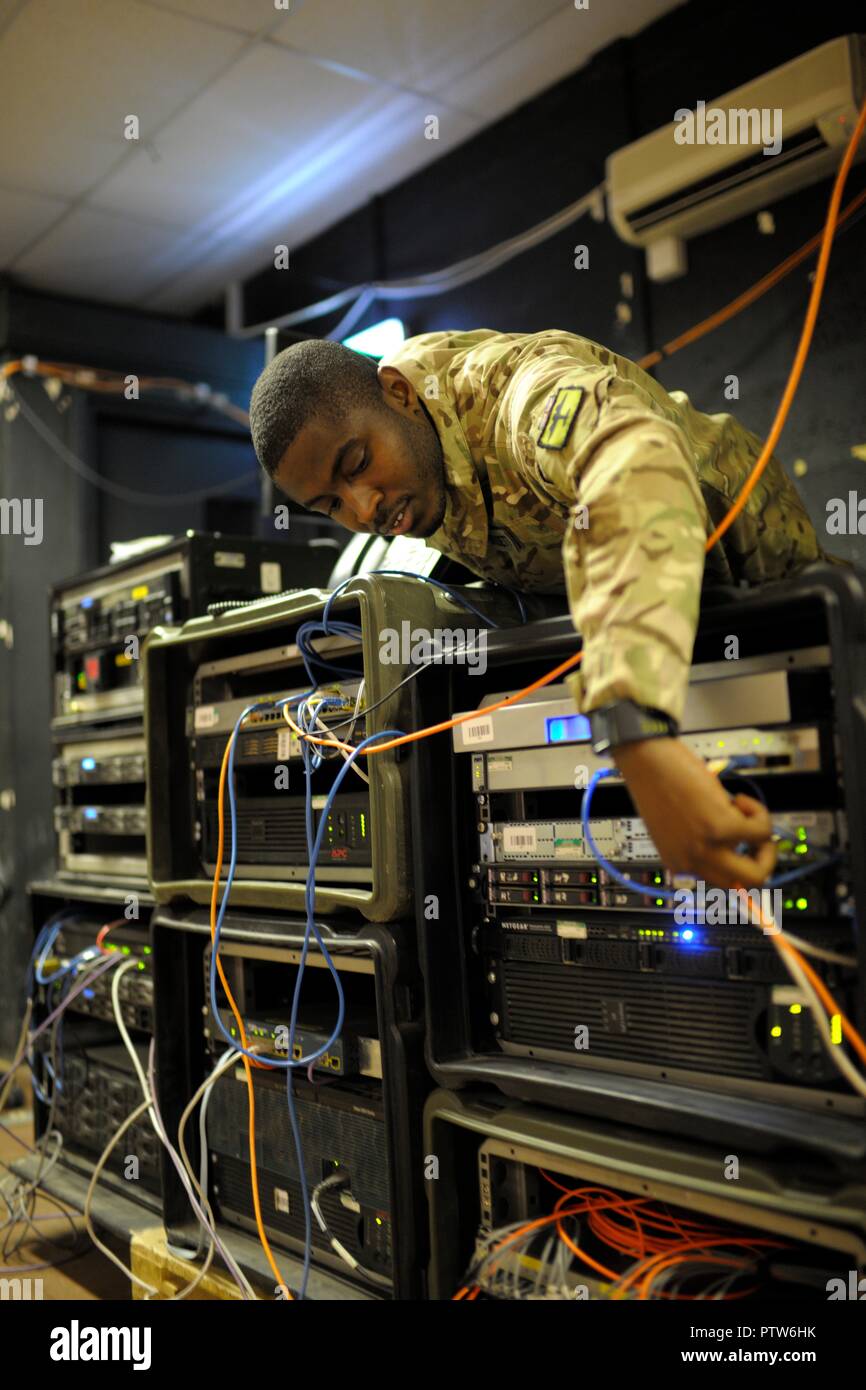 British Army soldier checks computer server equipment Stock Photo - Alamy