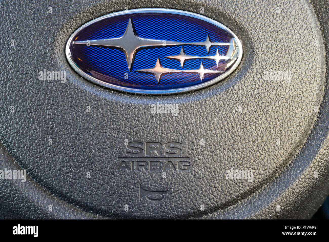 Subaru six star logo on steering wheel, with SRS airbag Stock Photo - Alamy