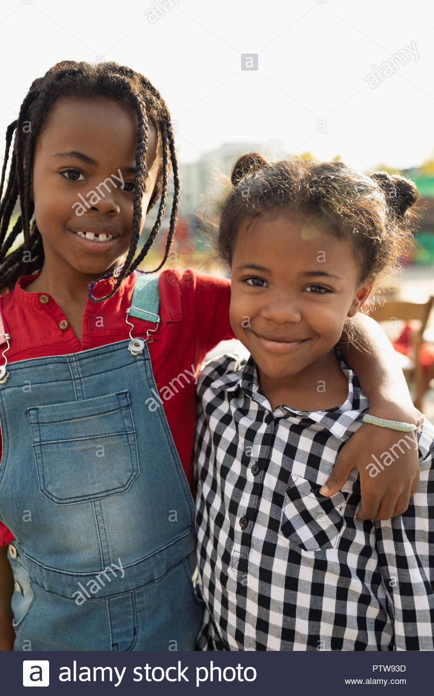 Portrait two happy sisters hugging hi-res stock photography and images ...