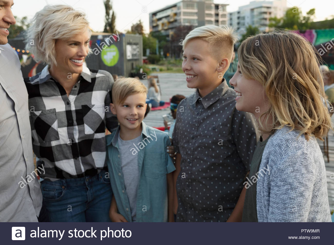 Two boys talking in park hi-res stock photography and images - Alamy