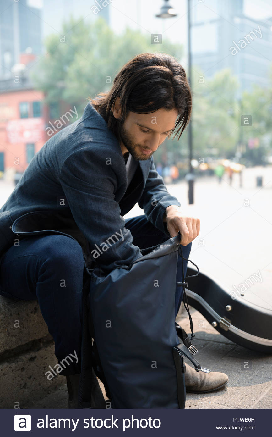 Reaching into bag hi-res stock photography and images - Alamy
