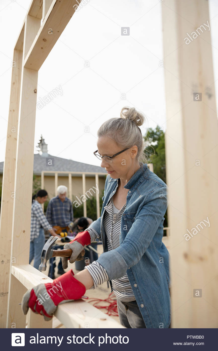 Woman with a hammer hi-res stock photography and images - Alamy