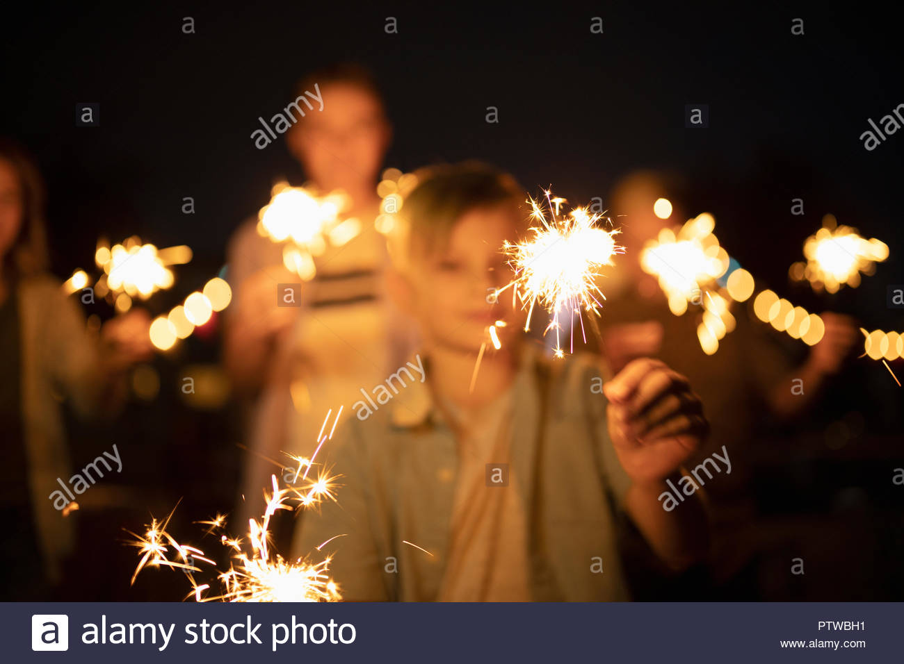 Playing with sparkler hi-res stock photography and images - Alamy
