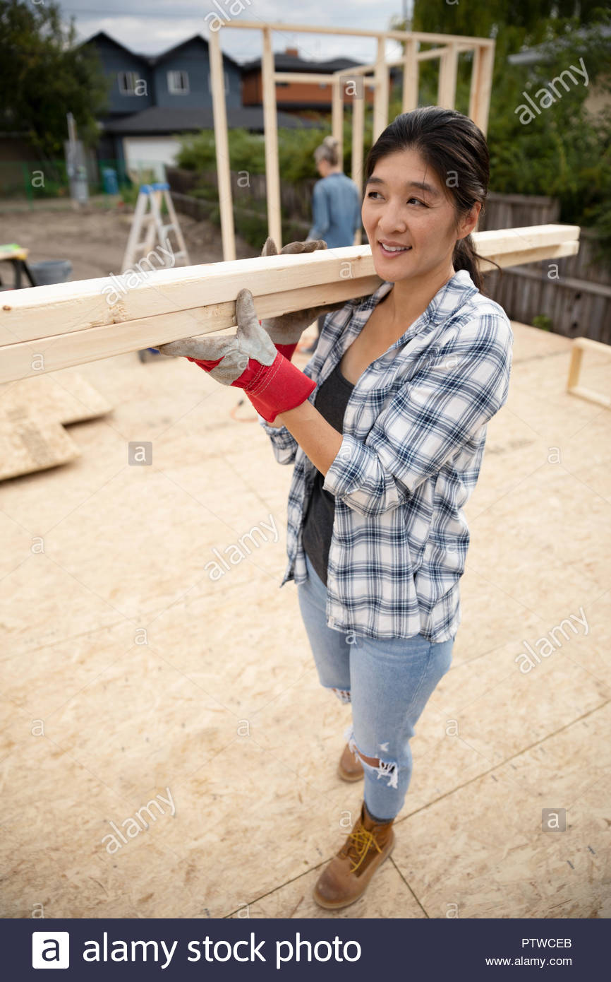 Woman construction worker carrying hi-res stock photography and images ...