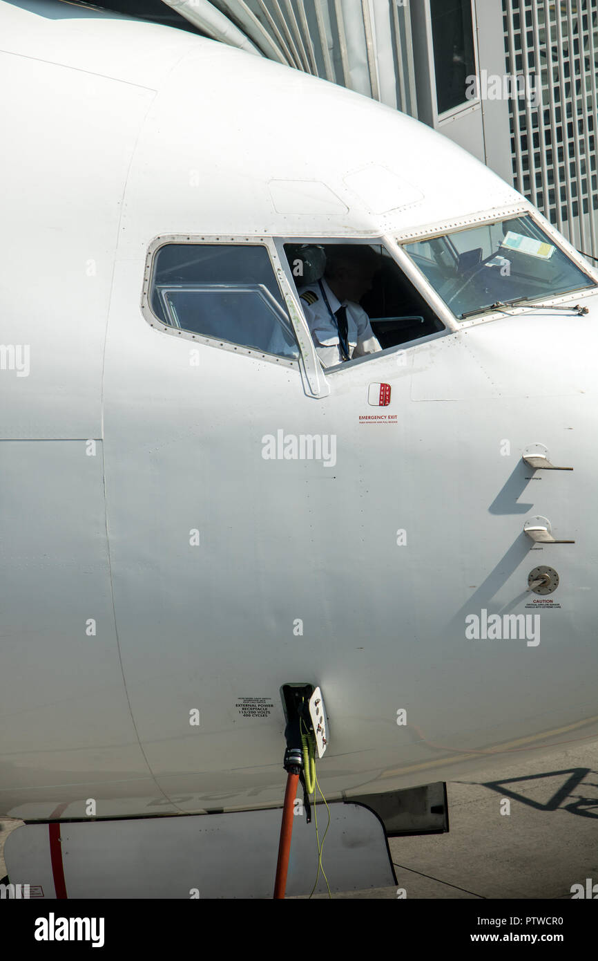 Cockpit of Airplane standing on a runway beside tunnel. Aircraft ...