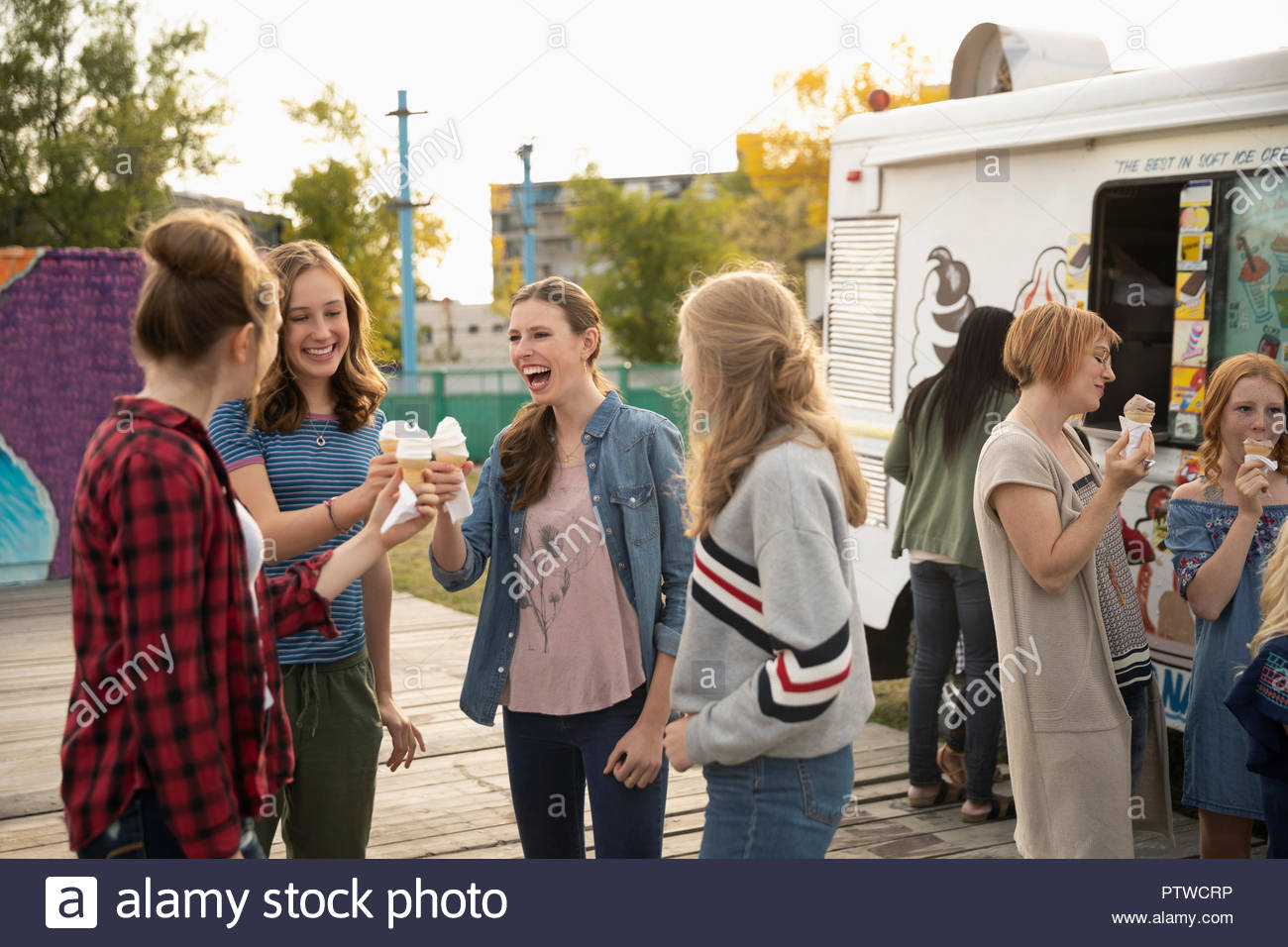 Friends holding ice cream cone hi-res stock photography and images - Alamy