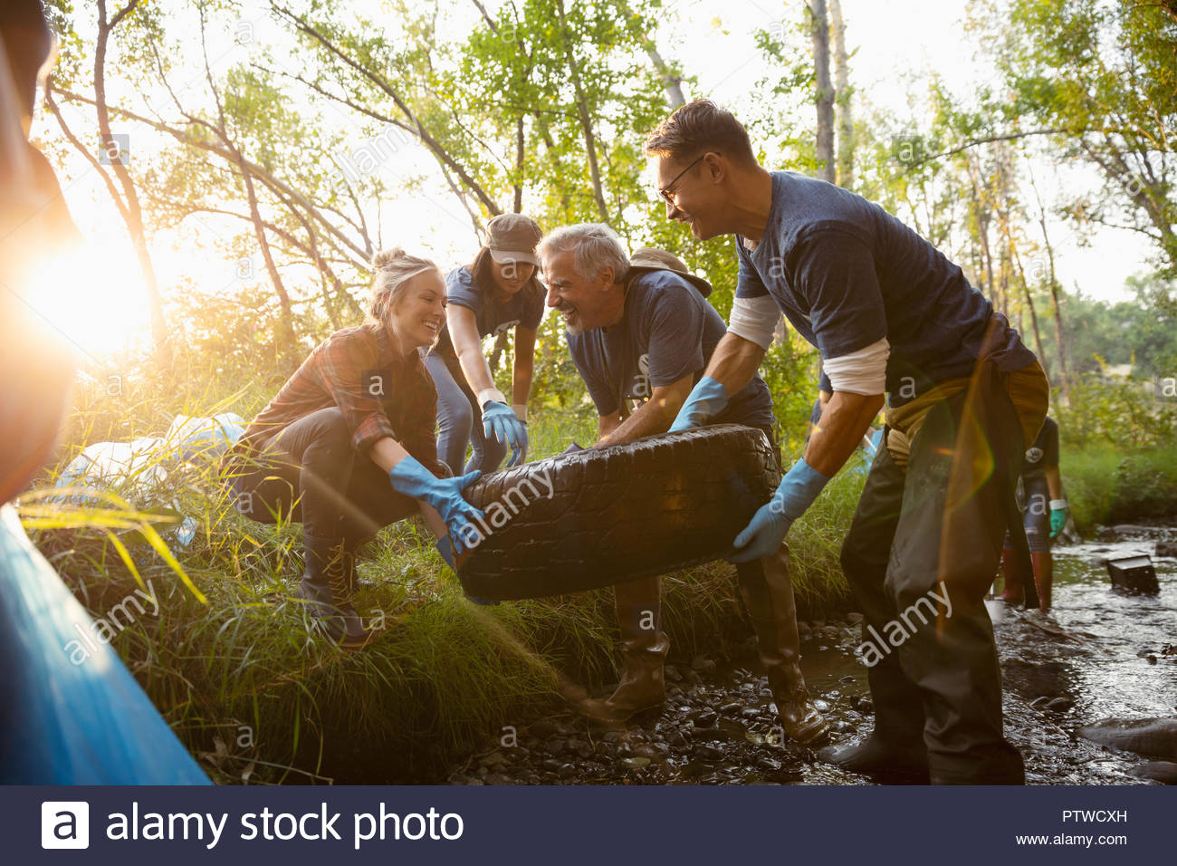 Girl lifting garbage hi-res stock photography and images - Alamy