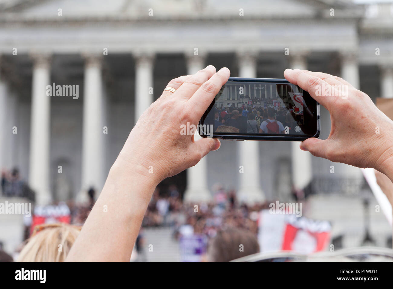 Woman recording video using mobile phone hi-res stock photography and ...