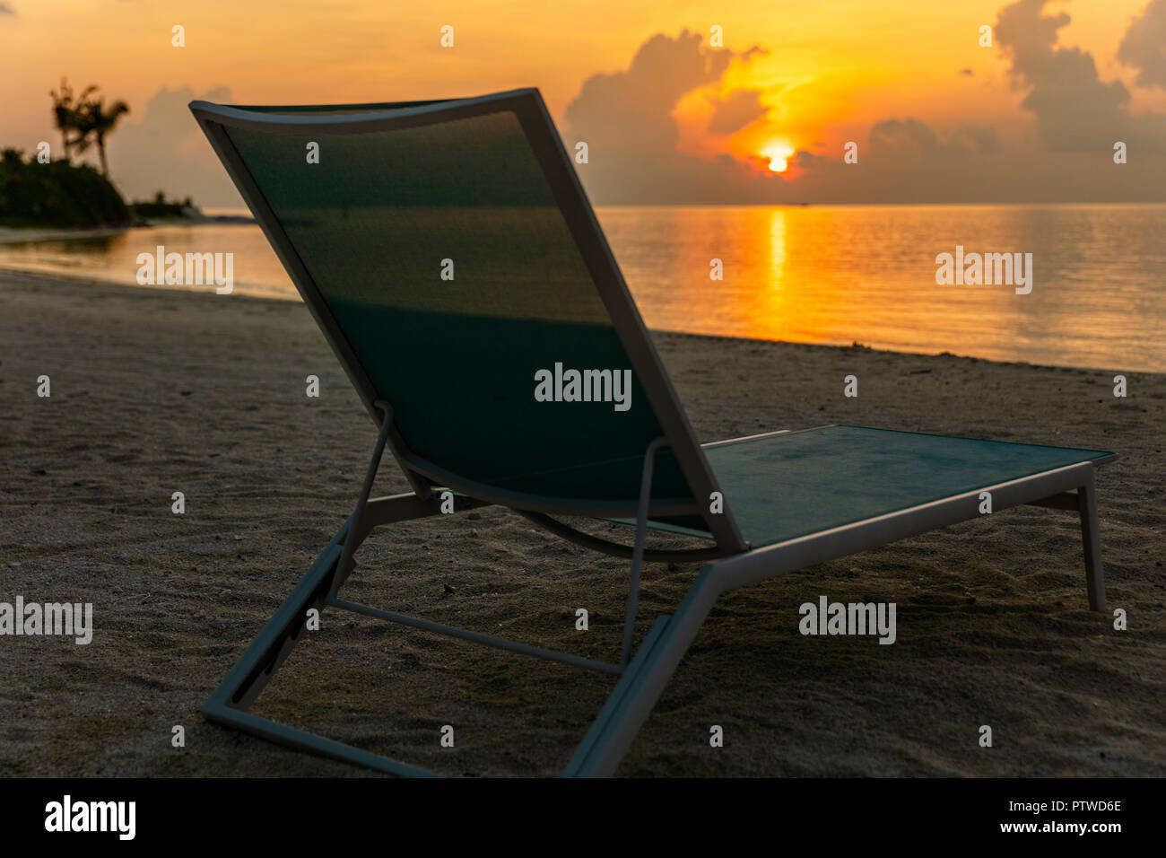 Blue beach resting chair on Maldivian tropical beach by the sea, at ...