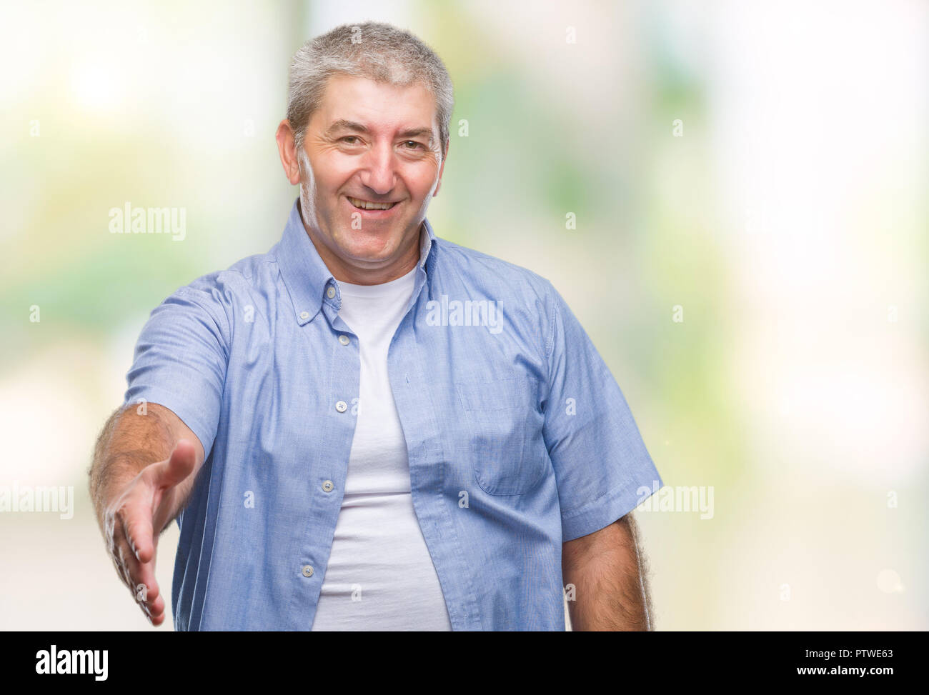 Handsome senior man over isolated background smiling friendly offering ...