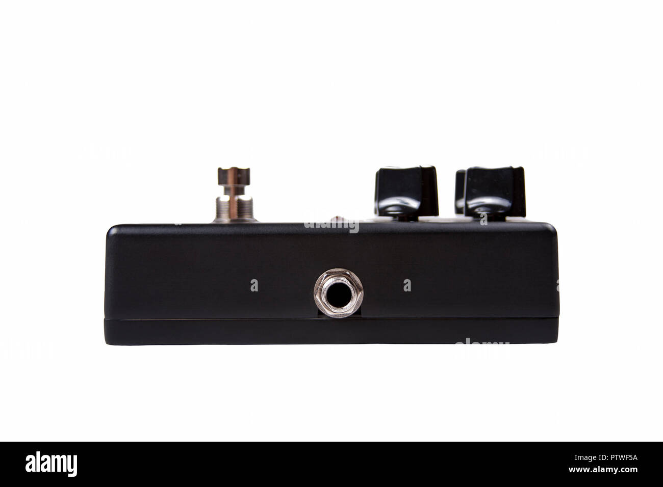 Black guitar effect pedal input - knobs side view, isolated on white ...