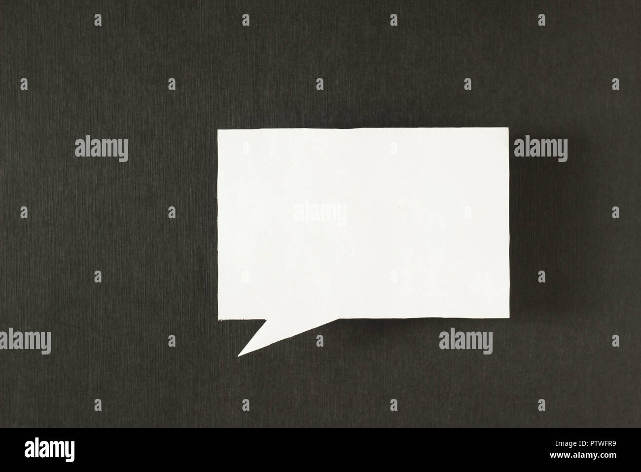 Symbol sign message from a white paper on a black background, social ...