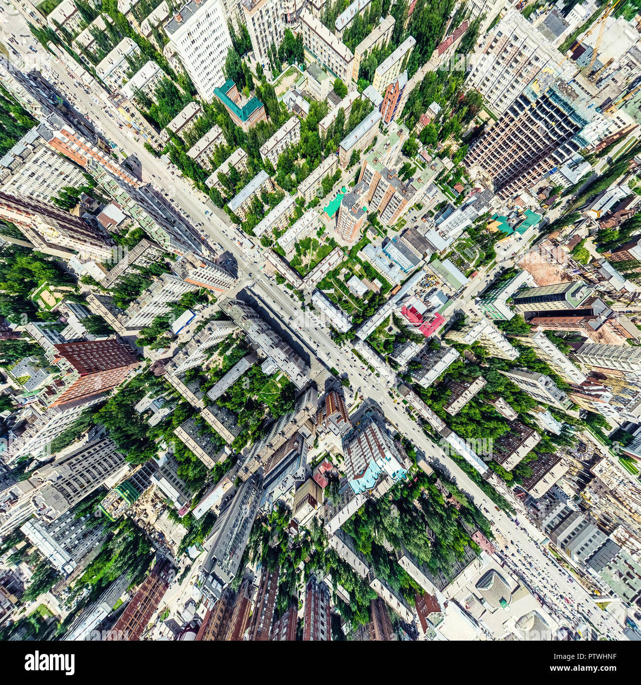 Aerial city view with crossroads and roads, houses, buildings, parks ...