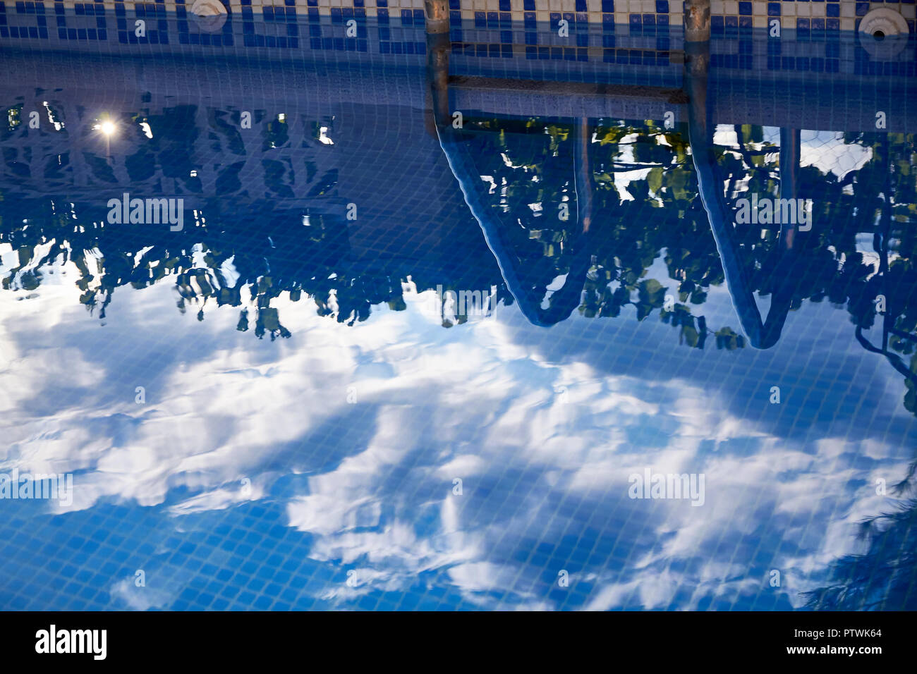 poolside with clear blue water Stock Photo - Alamy