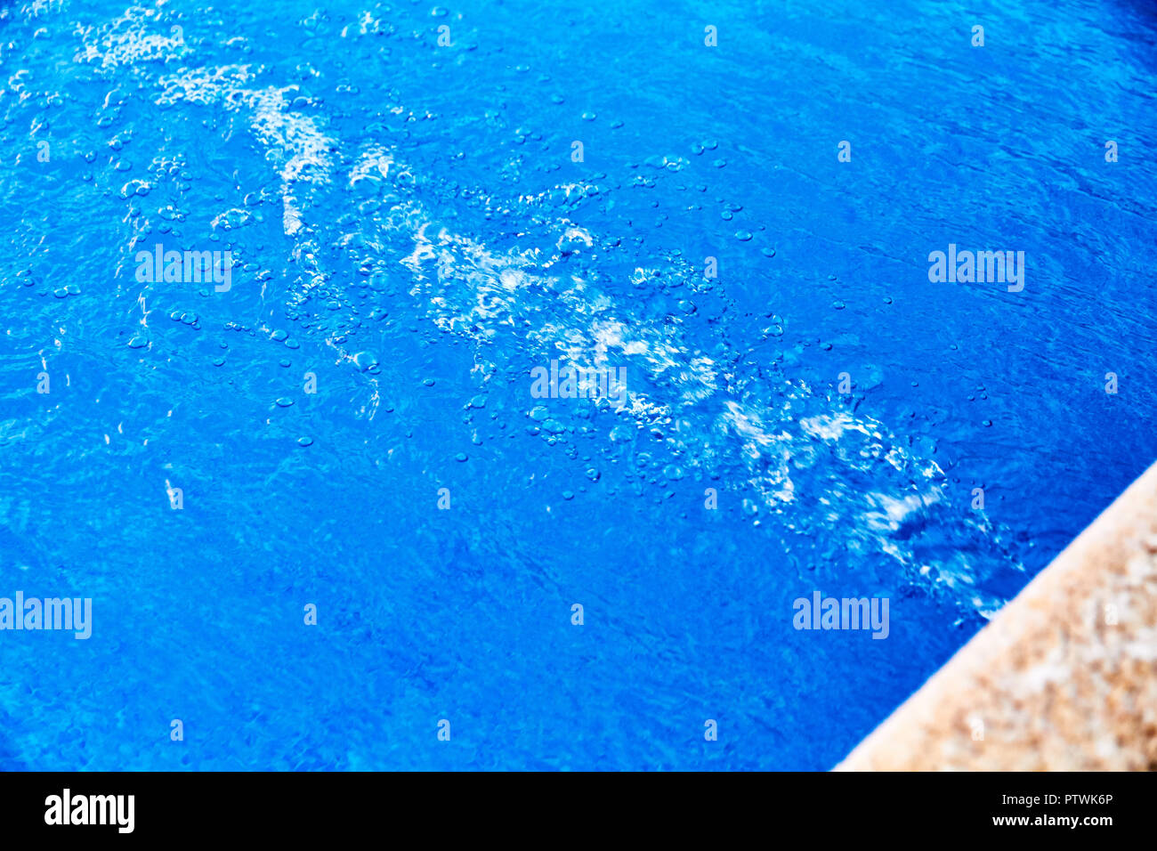 poolside with clear blue water Stock Photo - Alamy