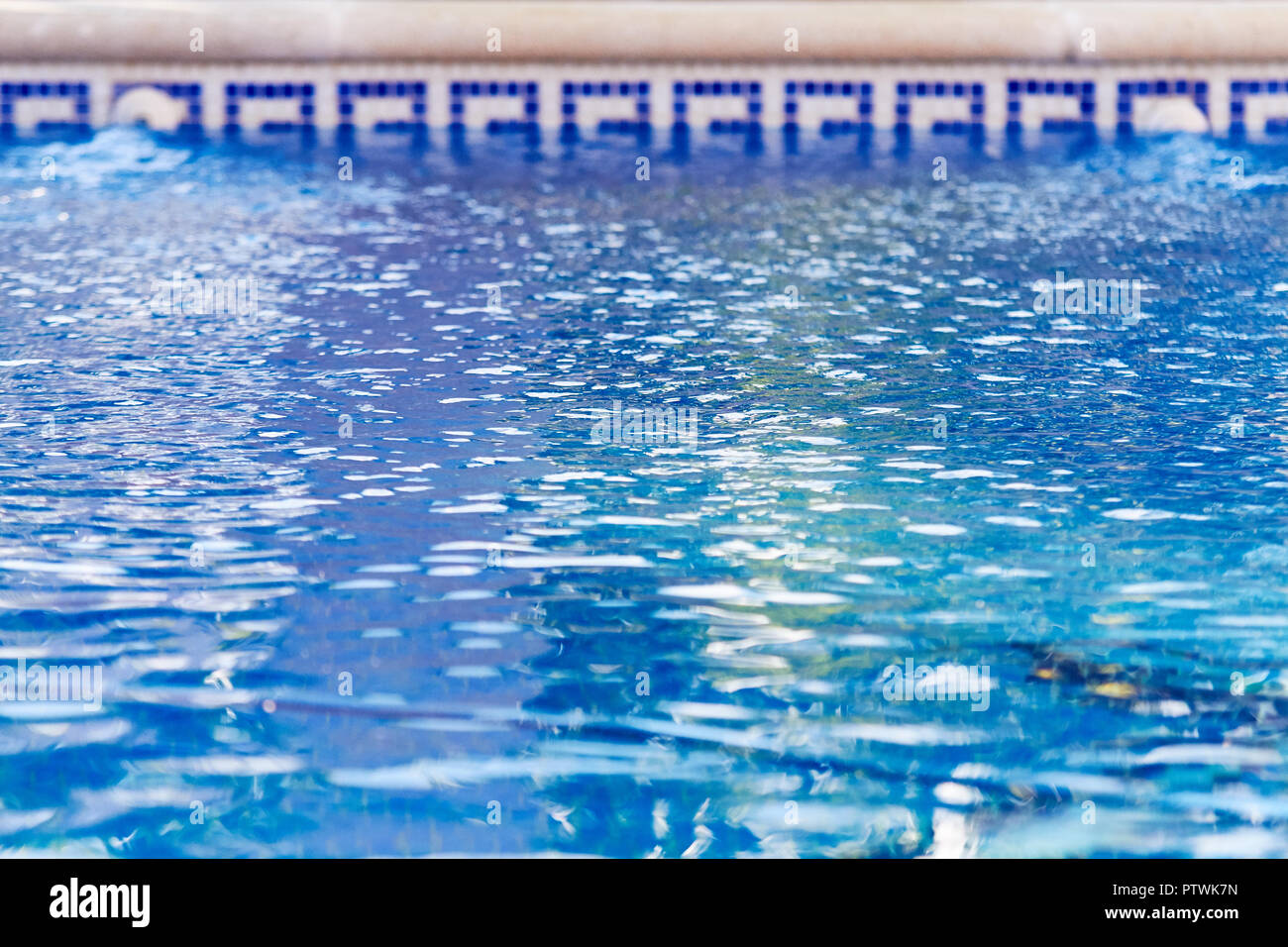 poolside with clear blue water Stock Photo - Alamy