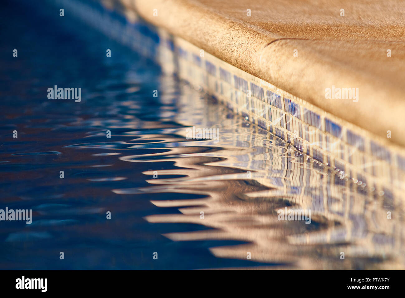 poolside with clear blue water Stock Photo - Alamy