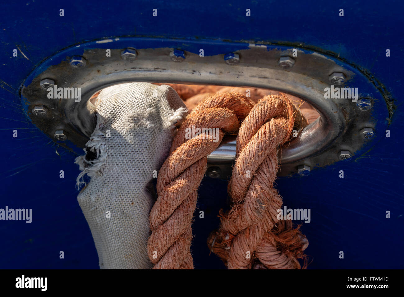 Mooring rope of a fishing boat in a fishing port. Rigging of vessels in ...