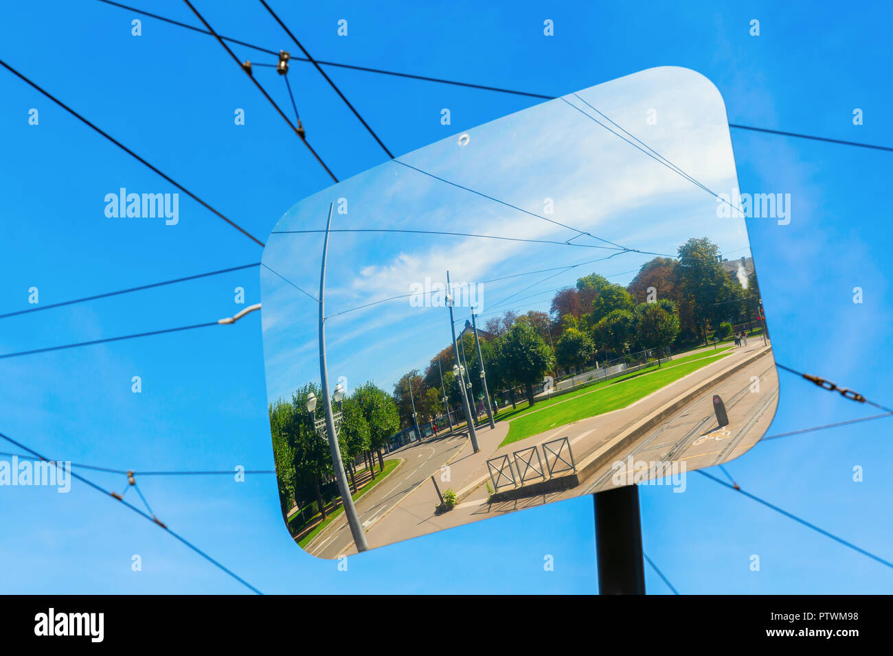 picture of a traffic mirror that reflects the Place de la Republique in ...