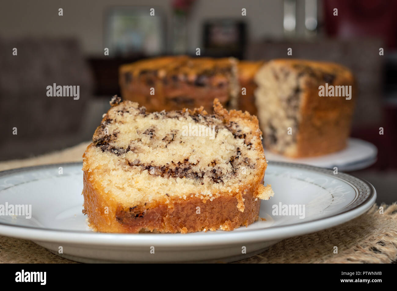 Slice of a mixed cake of chocolate and vanilla Stock Photo - Alamy