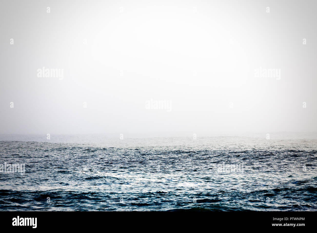 Minimalist foggy waves on the sea Stock Photo - Alamy