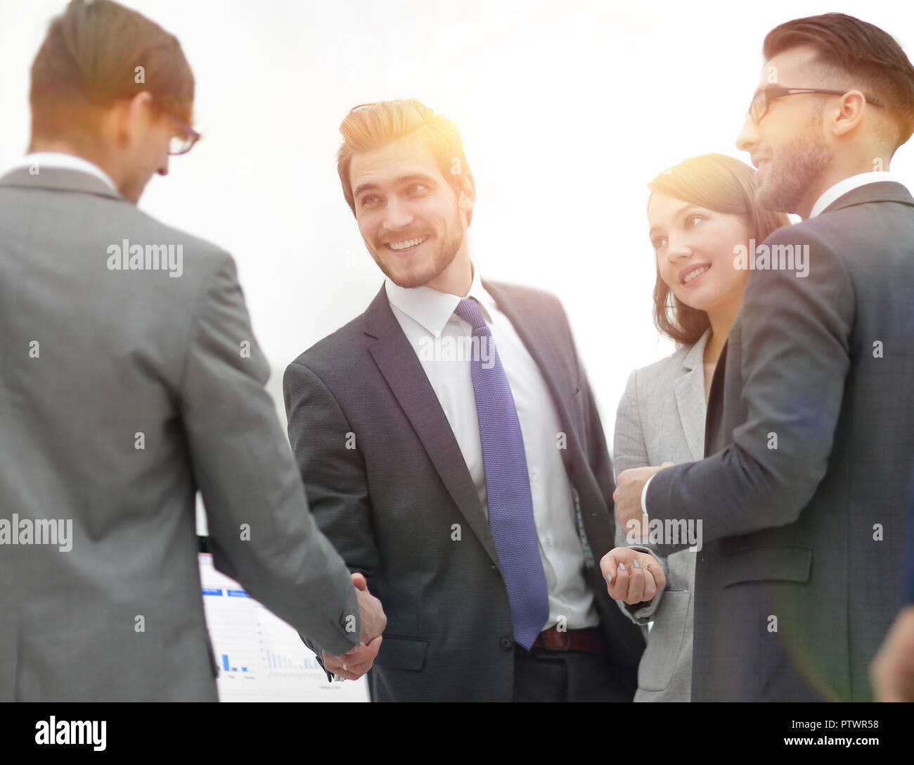 Confident young people, handshake and smile Stock Photo - Alamy