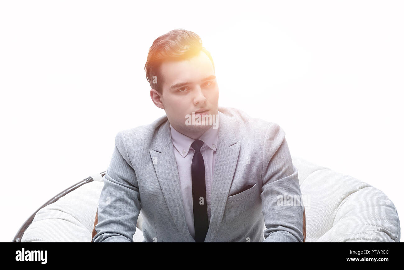 tired businessman sitting in a round chair made of rattan Stock Photo ...