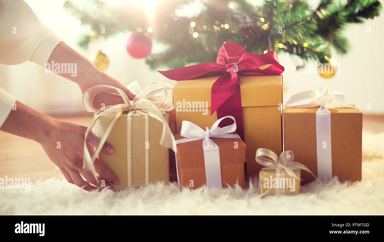 Hand placing gift hi-res stock photography and images - Alamy