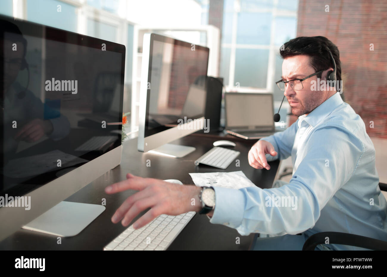 Man sitting in data centre hi-res stock photography and images - Alamy