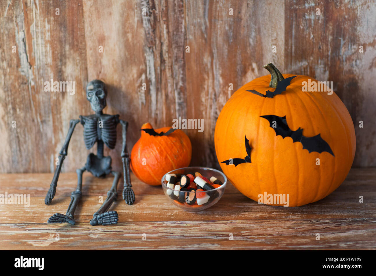halloween pumpkins, skeleton and candies Stock Photo - Alamy
