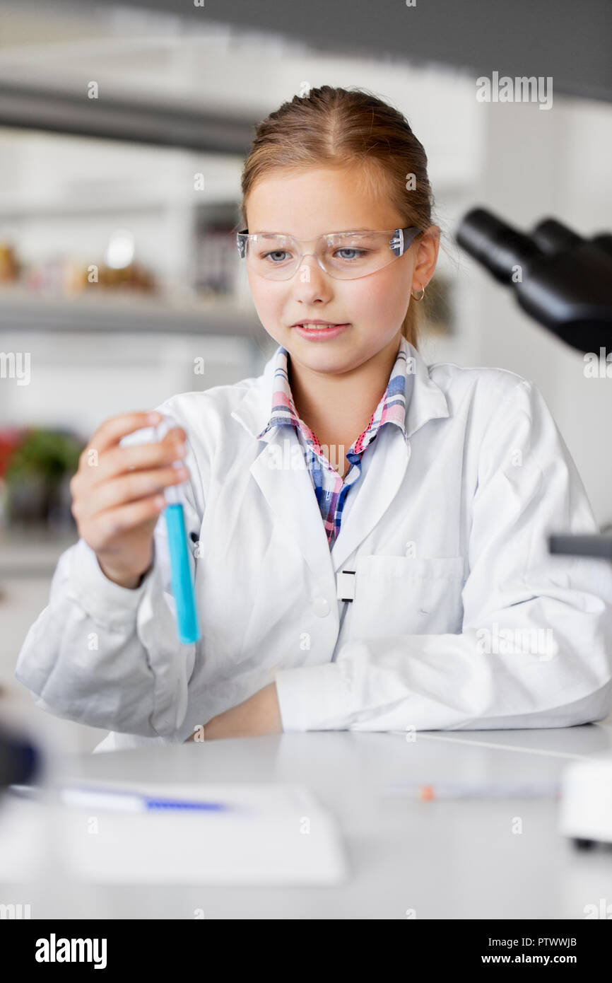 girl with test tube studying chemistry at school Stock Photo - Alamy