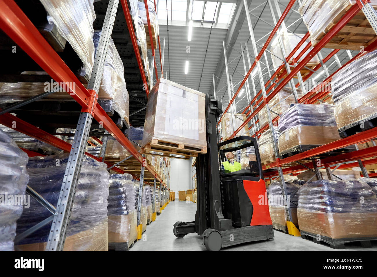 loader operating forklift at warehouse Stock Photo - Alamy