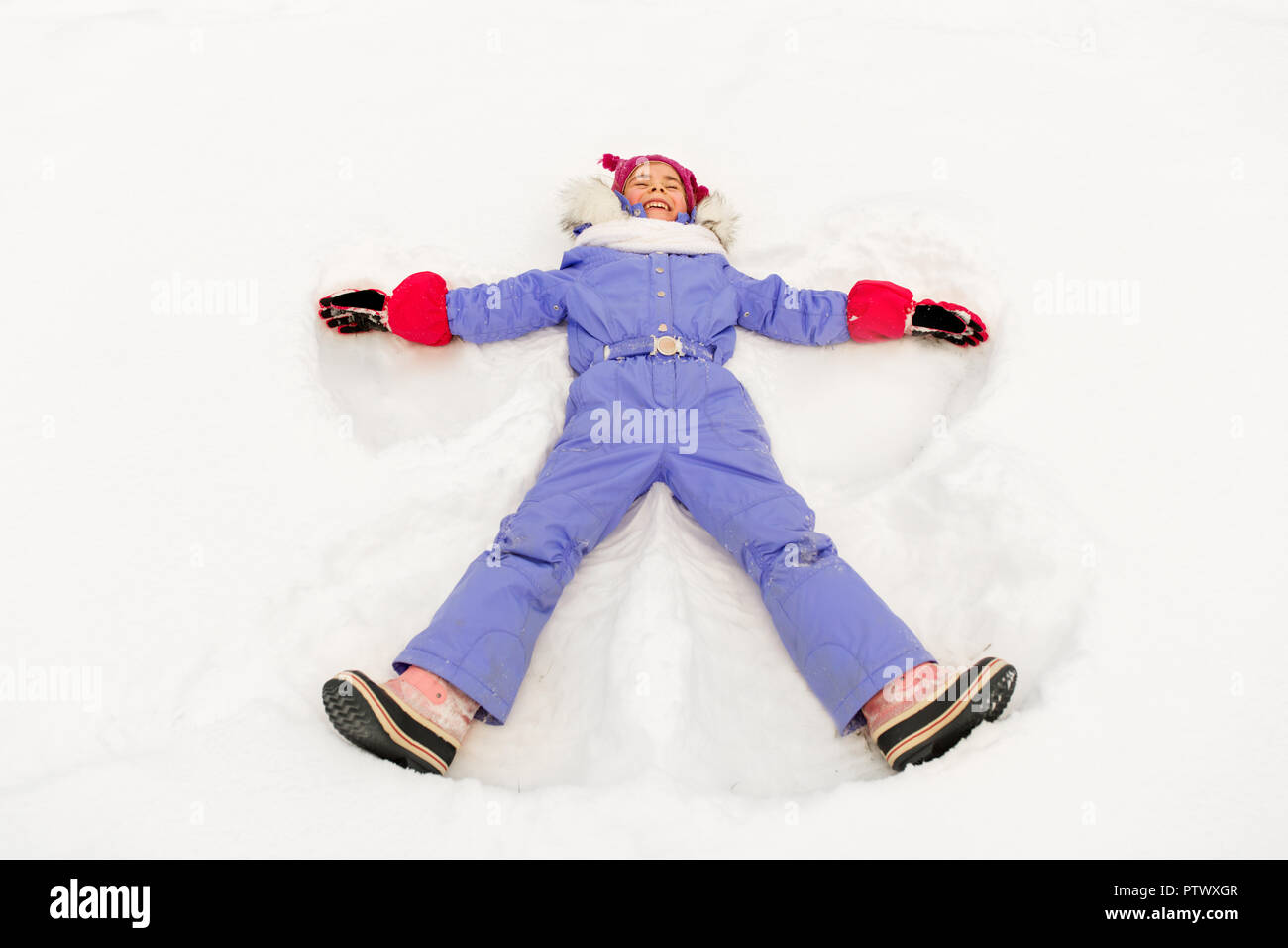 Girl making snow angel hi-res stock photography and images - Alamy