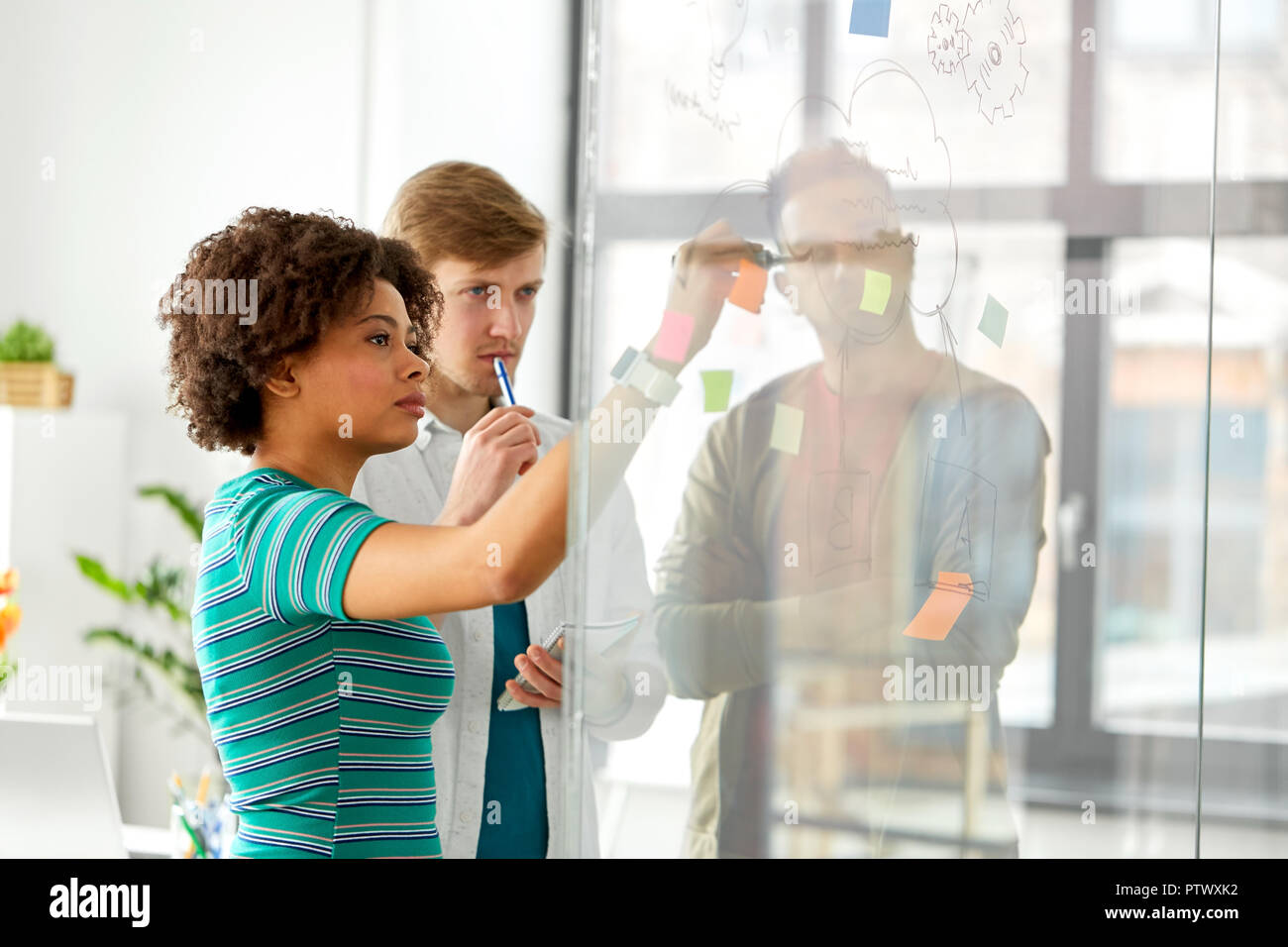 Creative african american entrepreneur writing hi-res stock photography ...