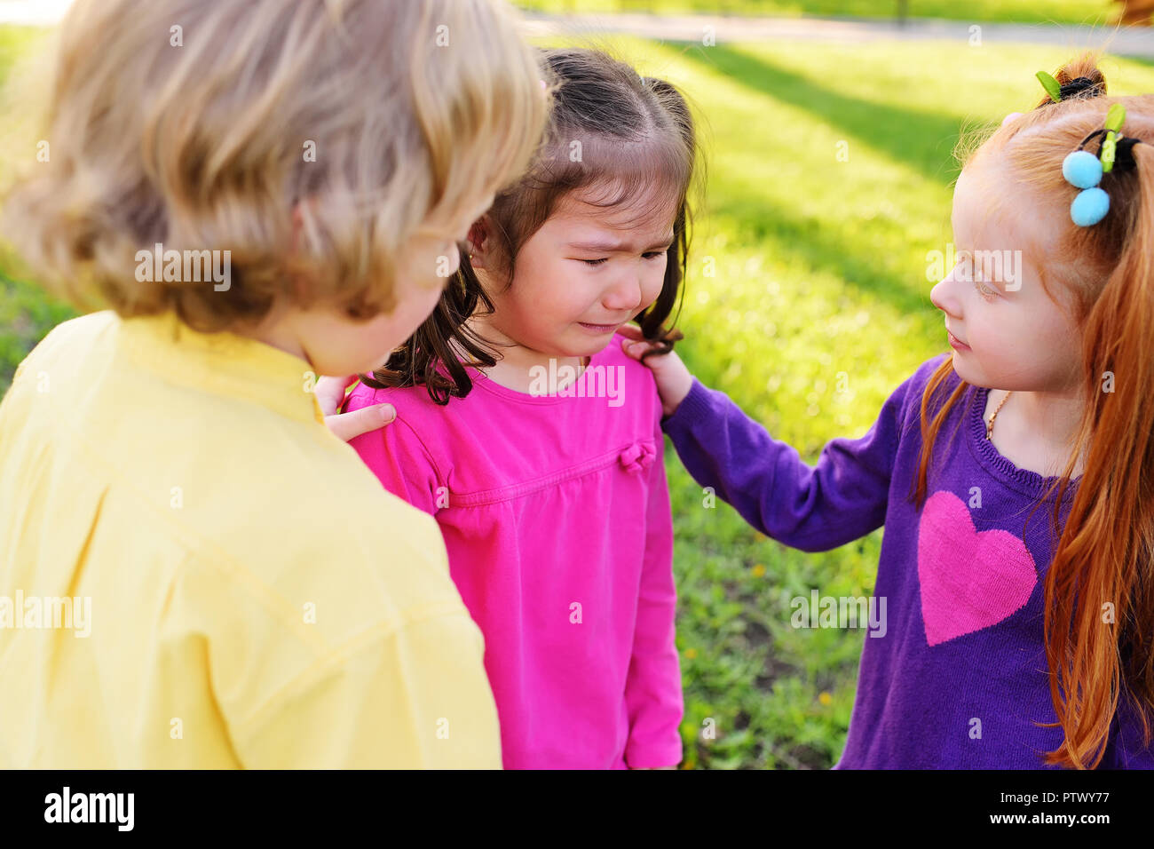 children feel sorry for a weeping little girl. Childhood, friends ...