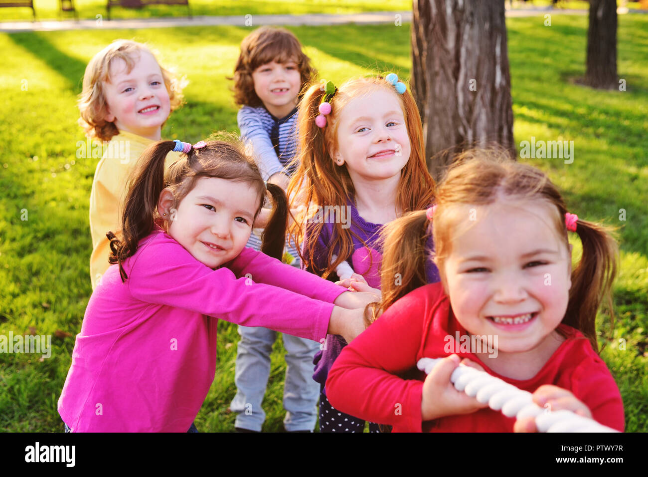 Children play tug of war in the park. Children's Day, June 1 ...