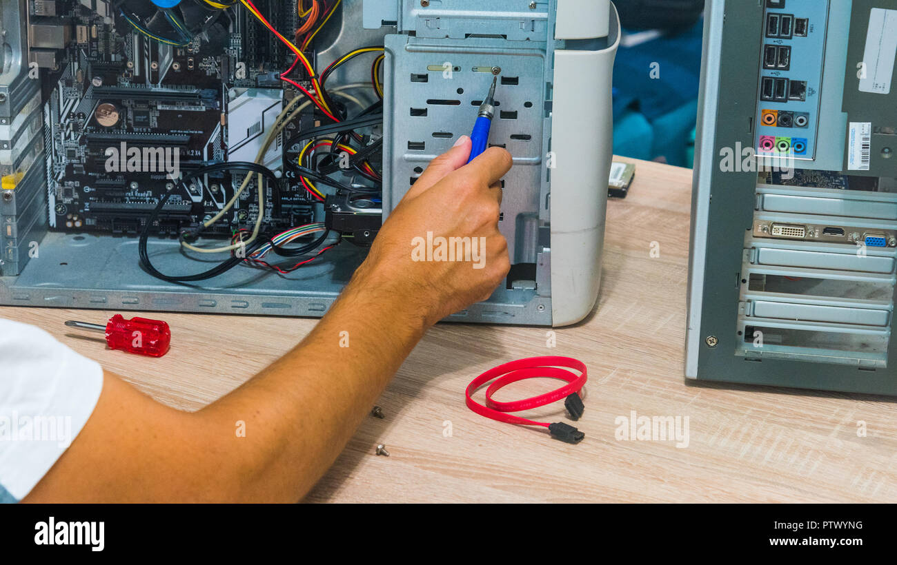 a man fixing a computer Stock Photo - Alamy